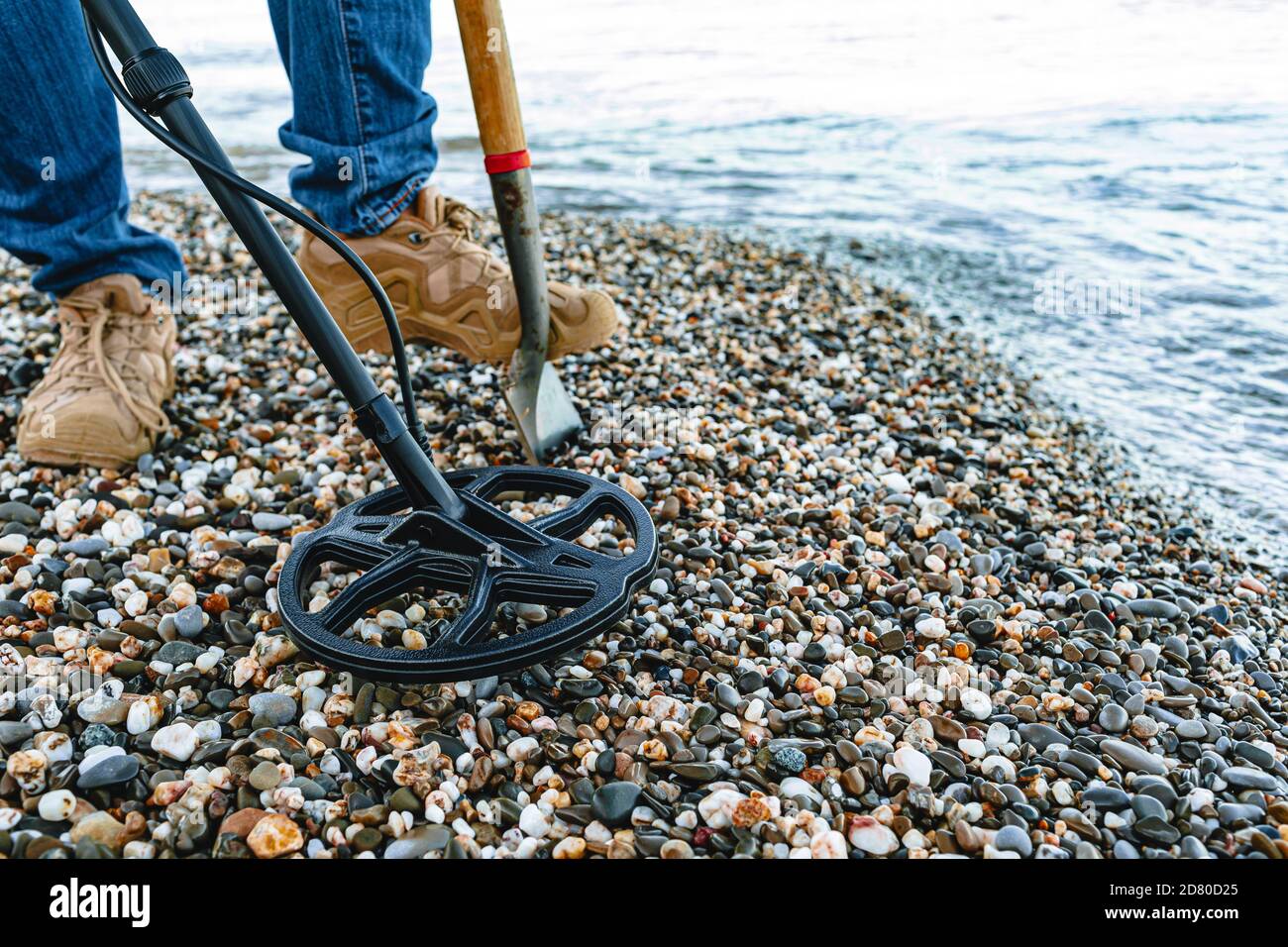 Metal detector coil in action above the ground Stock Photo - Alamy