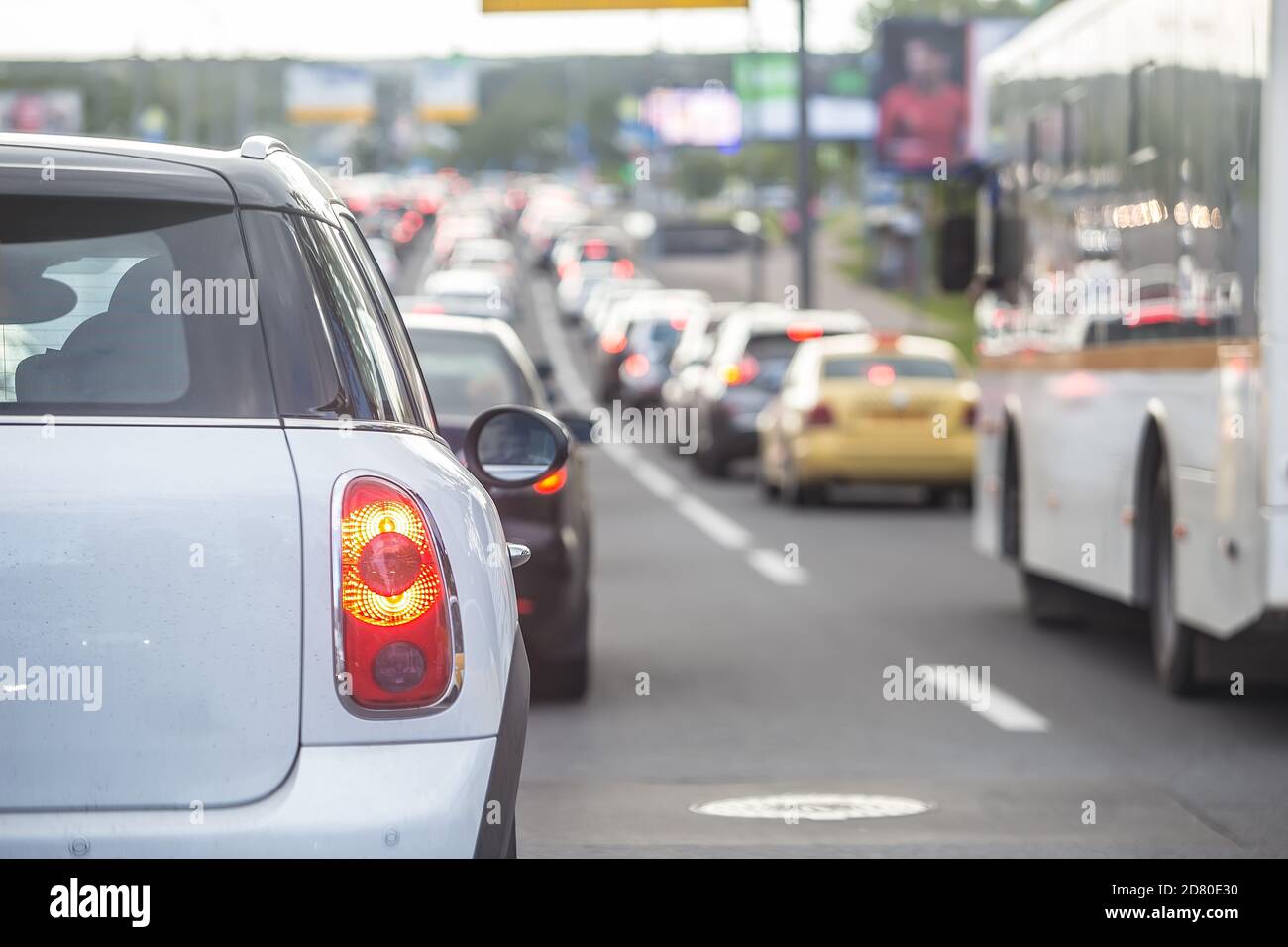 car in a big traffic jam. Back view. Blurred background Stock Photo - Alamy
