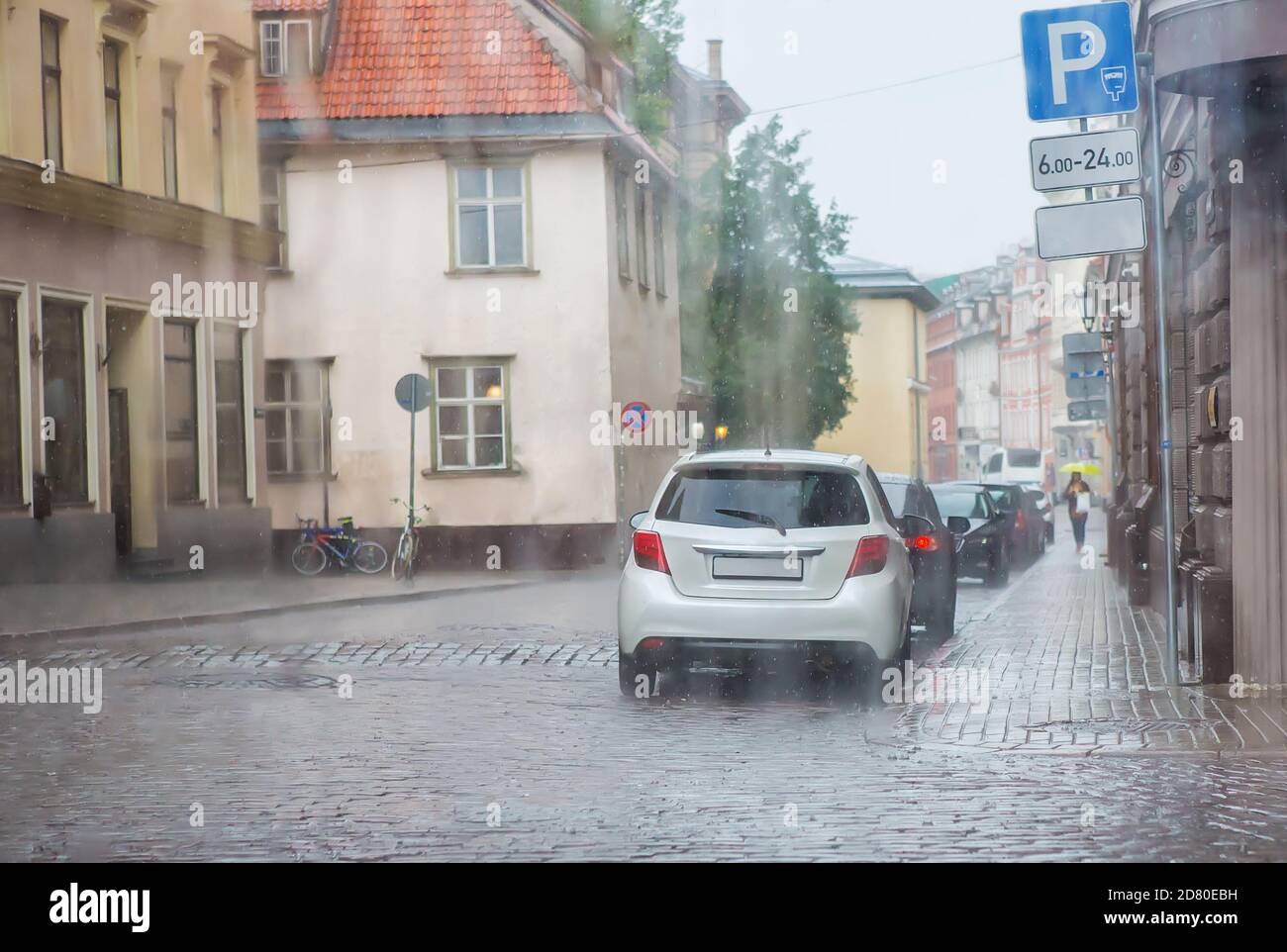 cars in the parking lot in the rain in the old historic center Stock ...