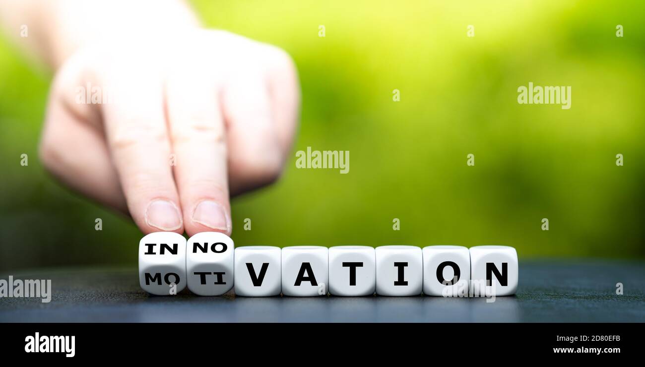 From a motivation to a innovation. Hand turns dice and changes the word ...