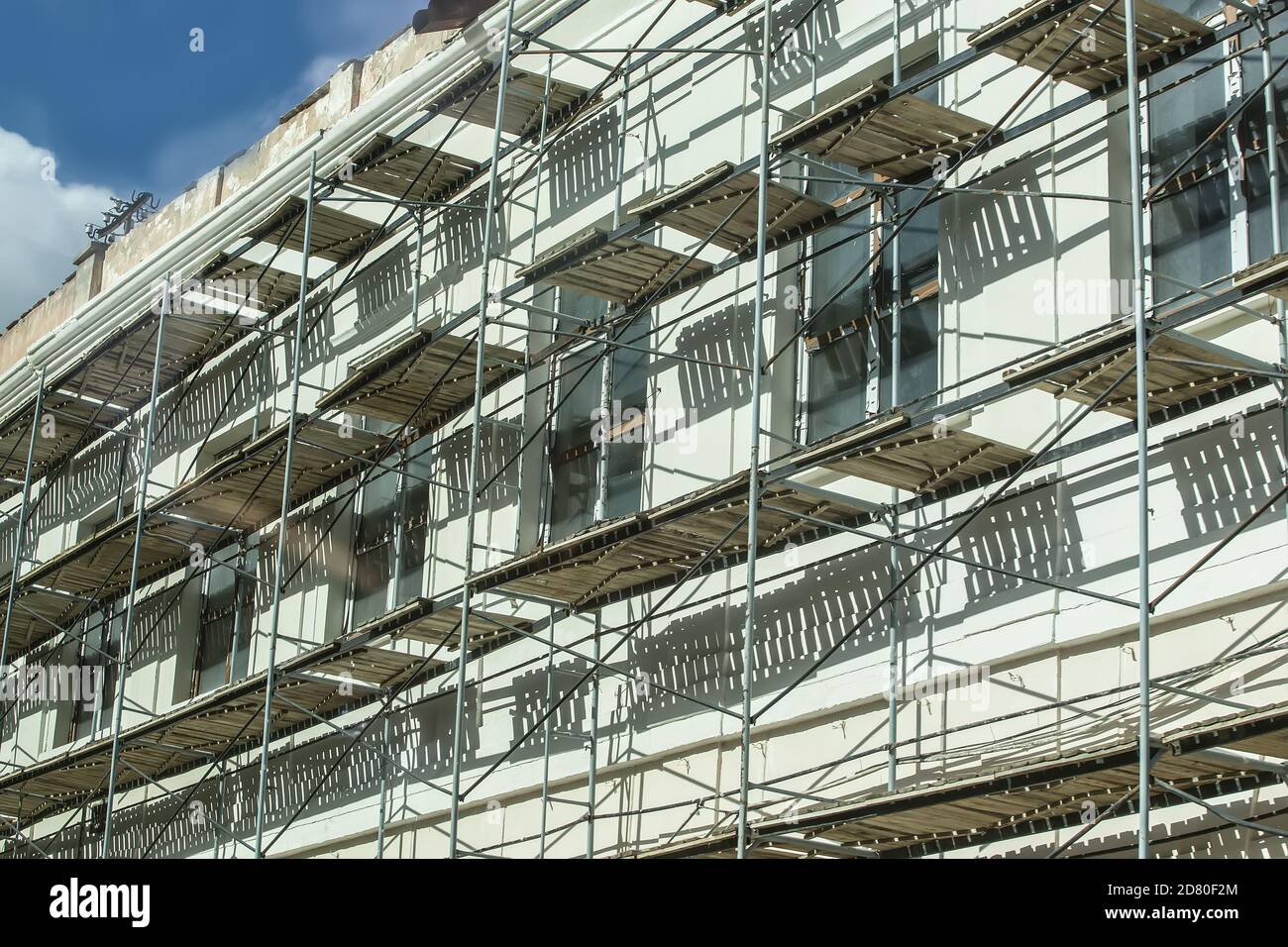Renovation of building front side. Scaffolding Stock Photo - Alamy