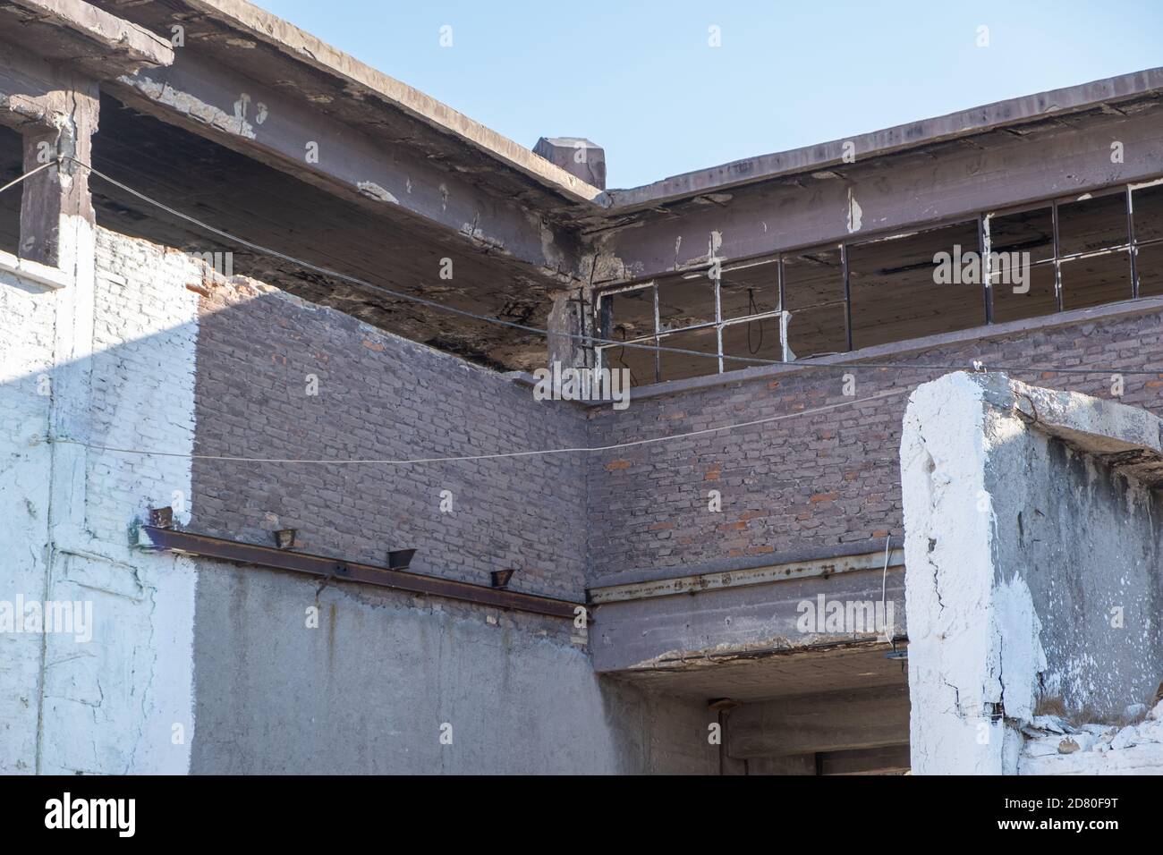 Old abandoned fertilizer factory brick and stone building facade ruins ...
