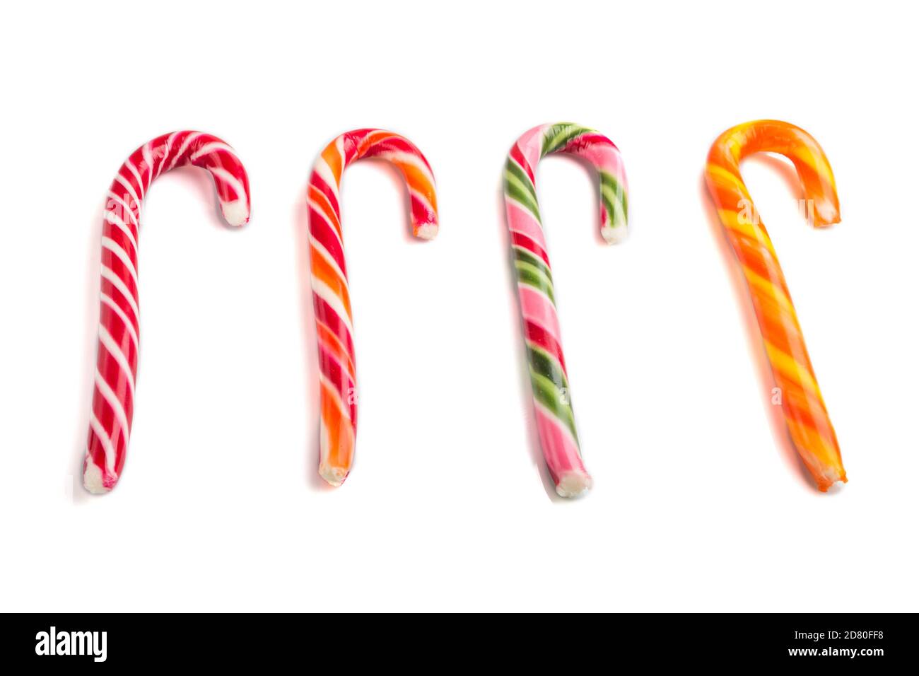 Four christmas cane candies isolated on white background. close up ...
