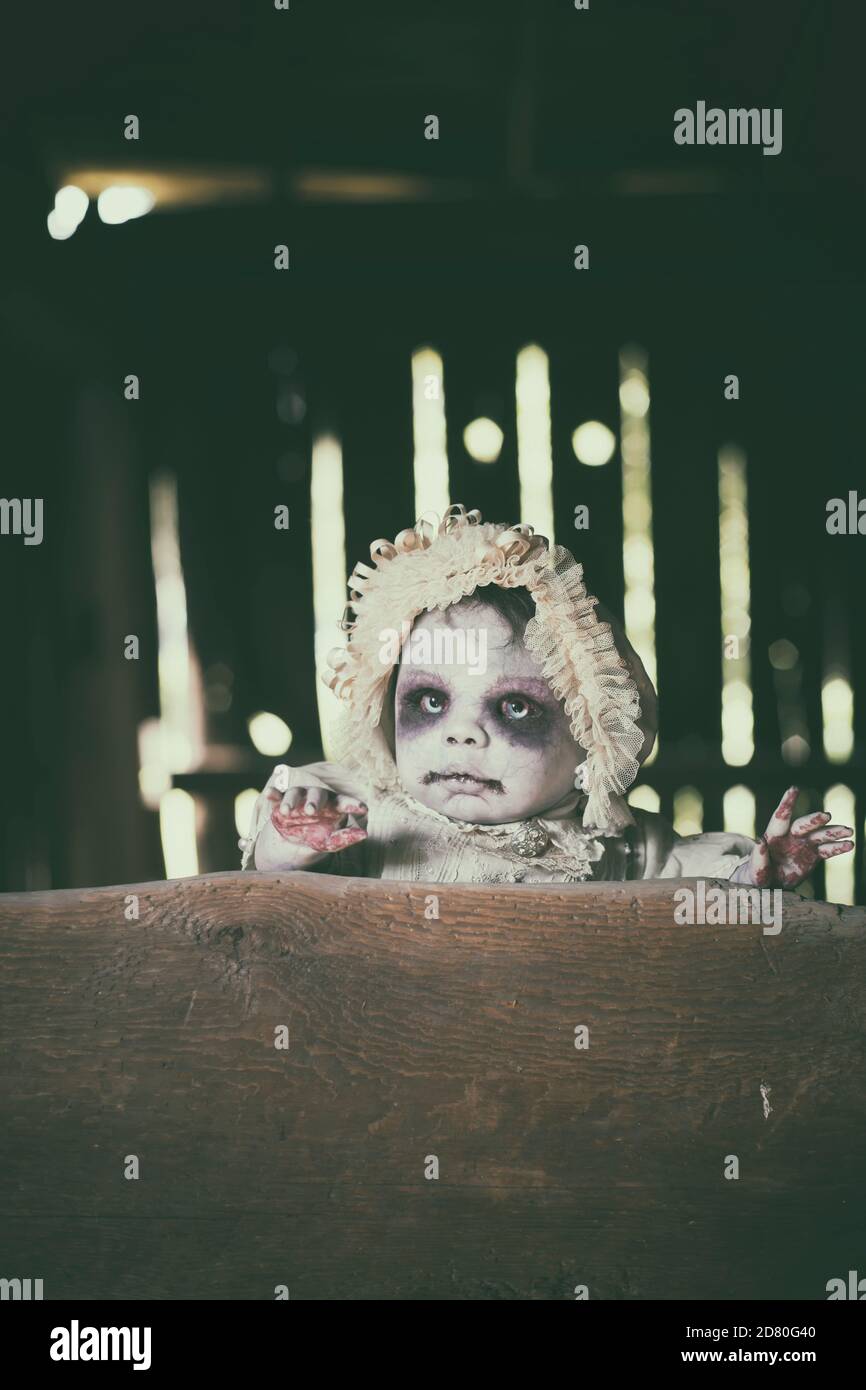 Very creepy baby Doll Stock Photo - Alamy