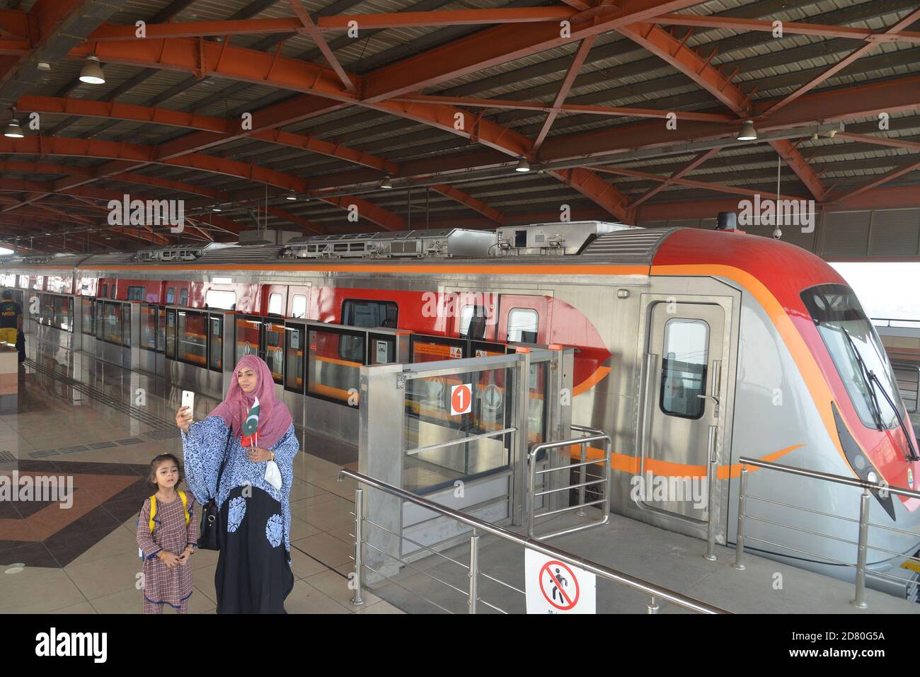 Pakistani and Chinese people holding both countries national flags and ...