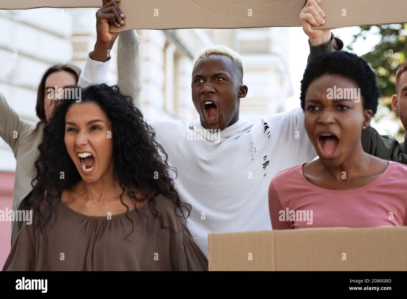 Furious demonstrators making strike against racism, pollution, war ...