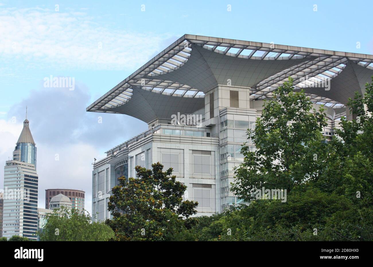 Exterior view of Shanghai Urban Planning Exhibition Center with leafy ...