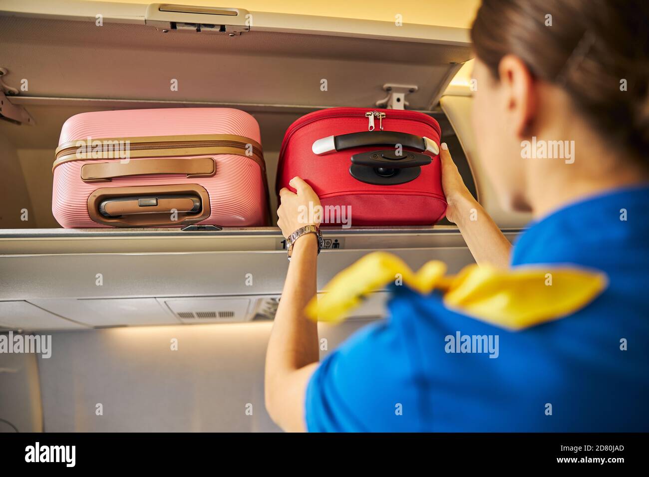 Overhead compartment hi-res stock photography and images - Alamy