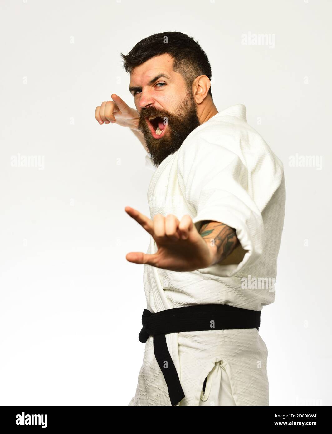 Karate man with angry face in uniform. Oriental sports concept ...