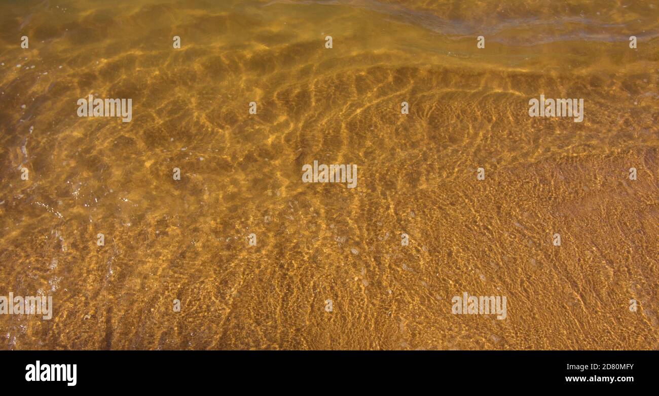 Texture background with surf, sea water and sand on the beach Stock ...