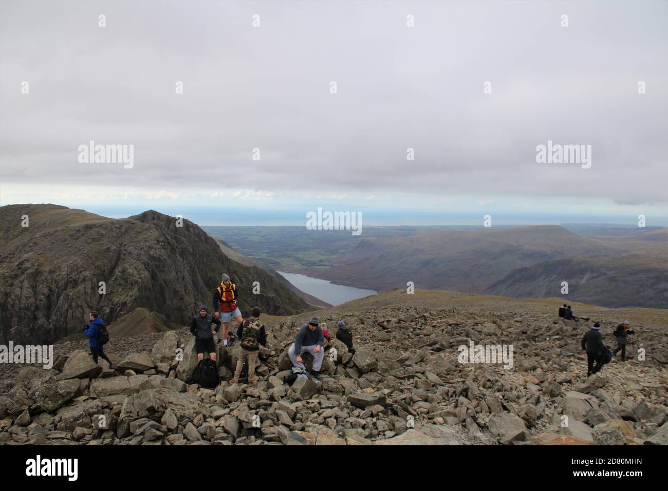 people on the summt of scafell pike in the Lake District in autumn ...