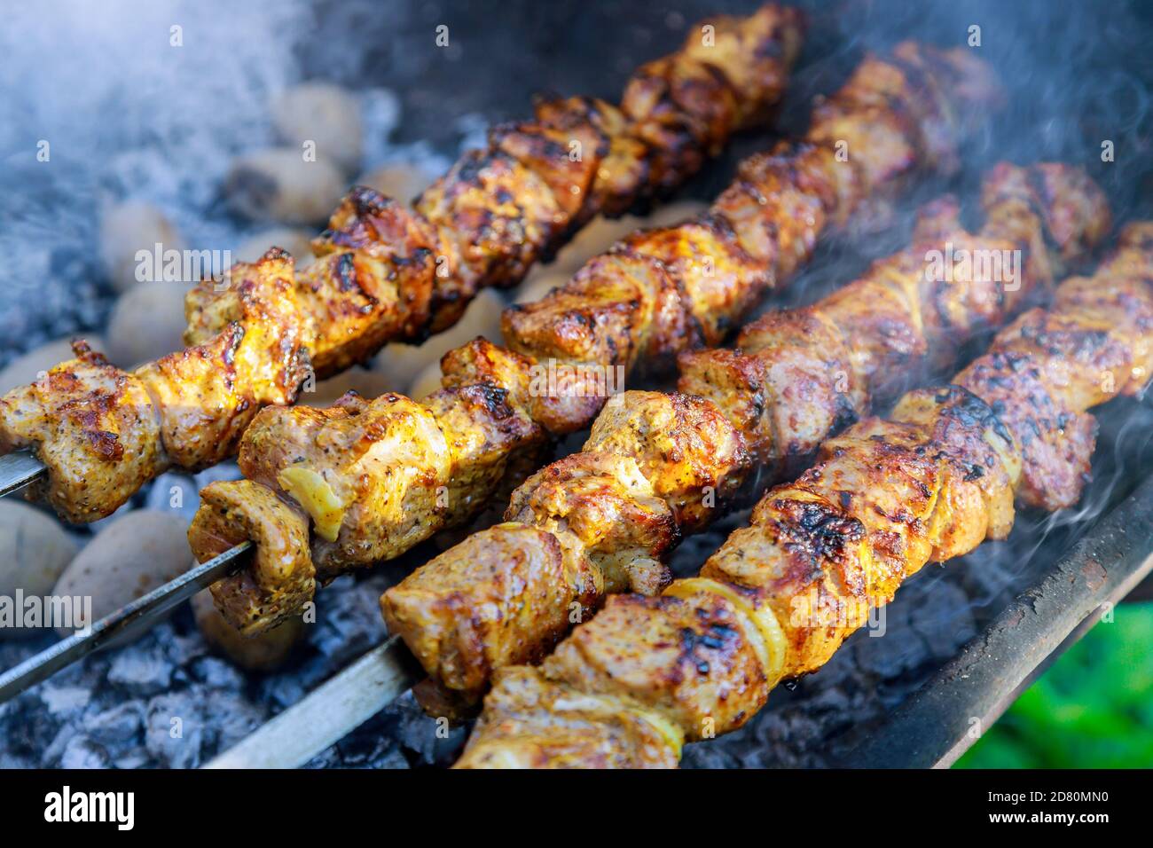 Grilled chicken meat shish kebab on skewers outdoor Stock Photo - Alamy