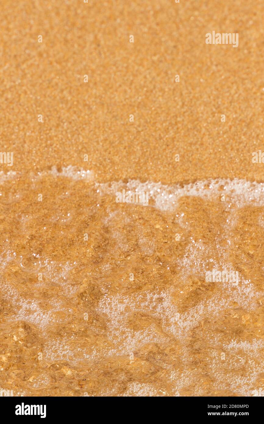 Texture background with surf, sea water and sand on the beach Stock ...