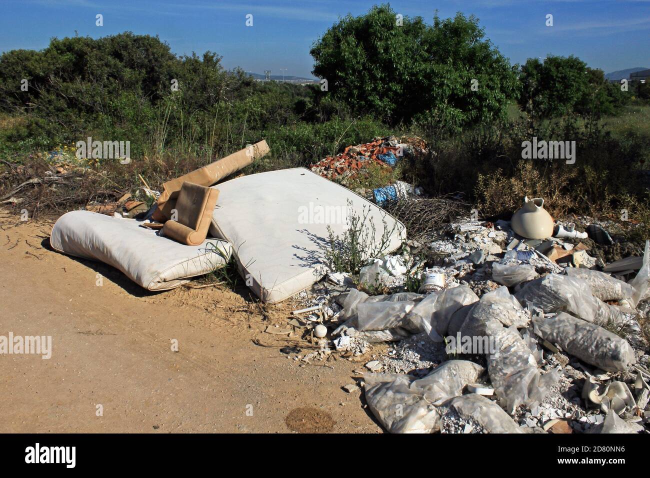 Garbage dump across forest road in the outskirts of Athens in Attica ...