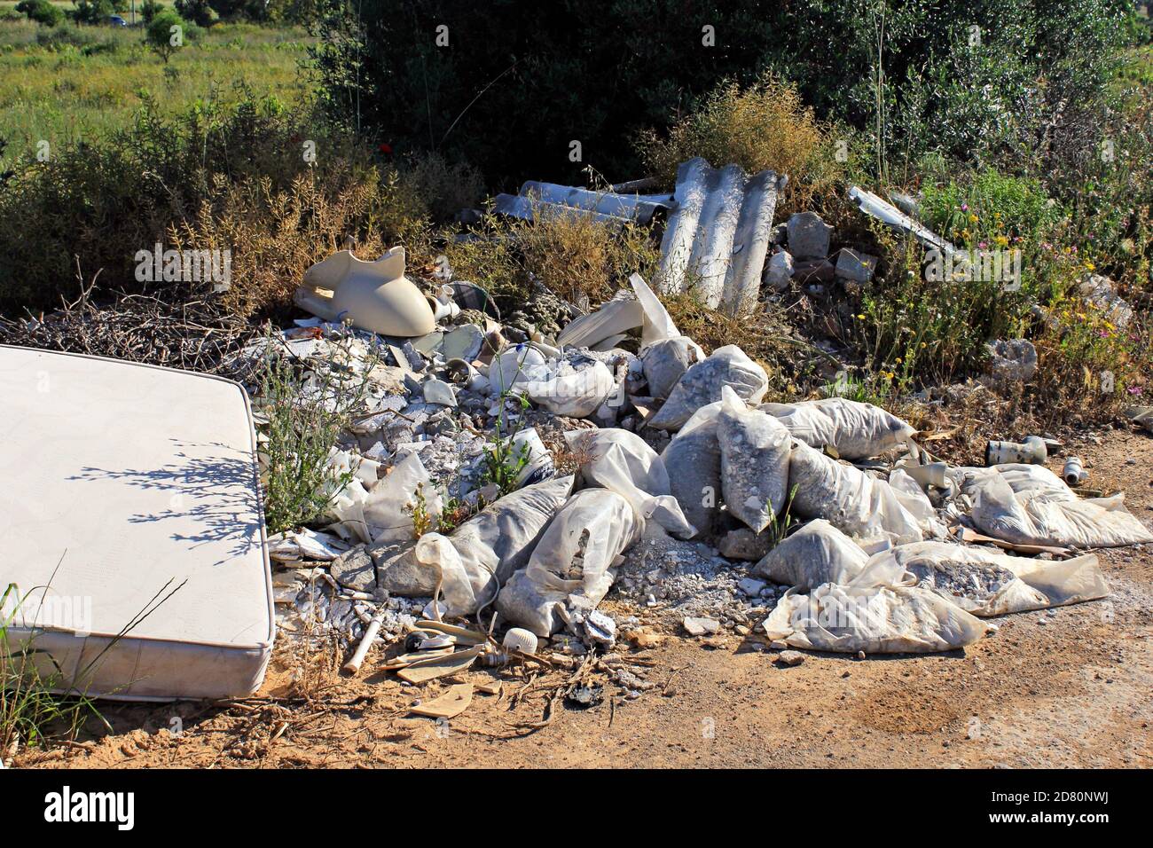 Garbage dump across forest road in the outskirts of Athens in Attica ...