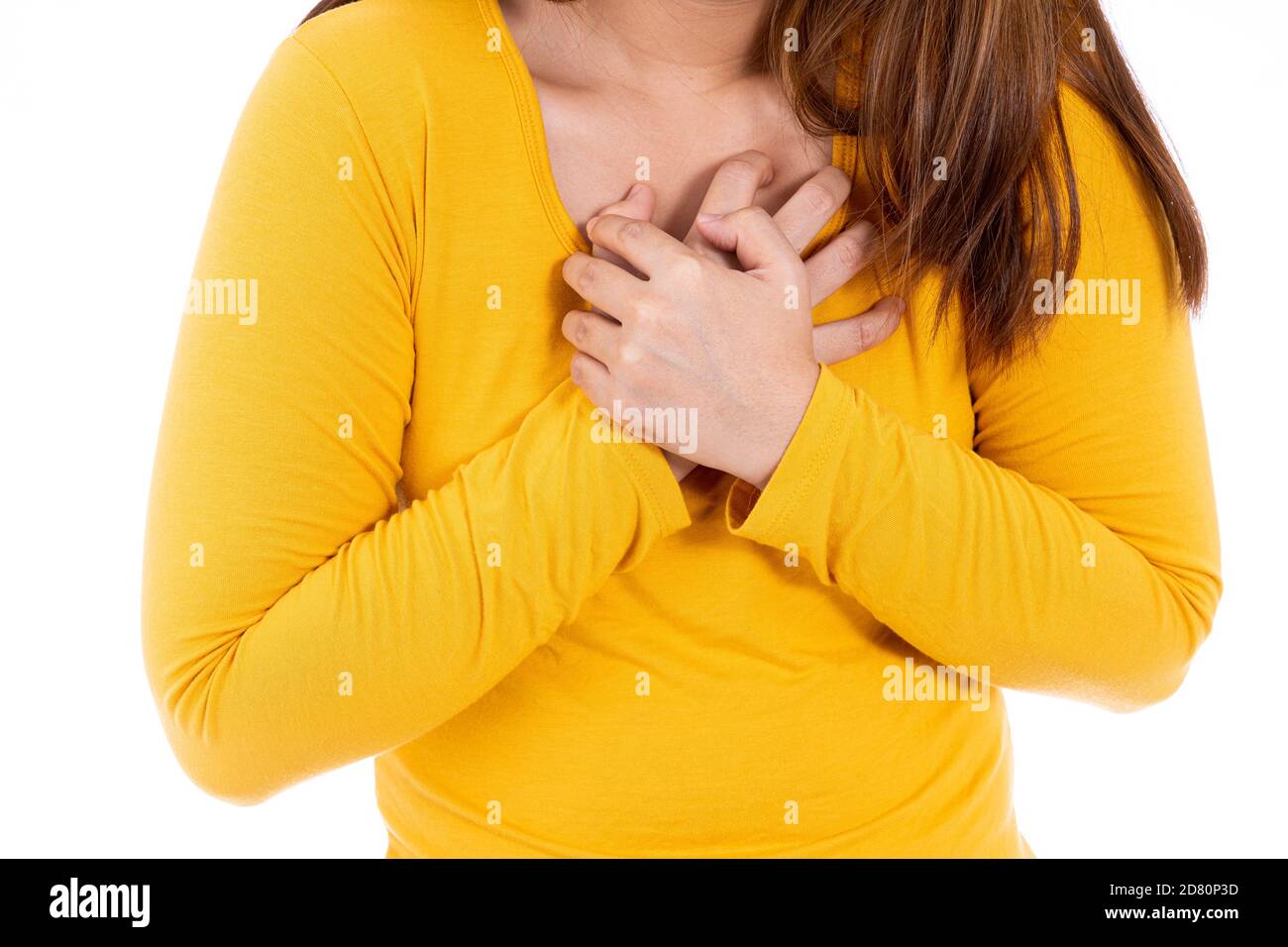 Woman touching her heart or chest isolated white background. Healthcare ...