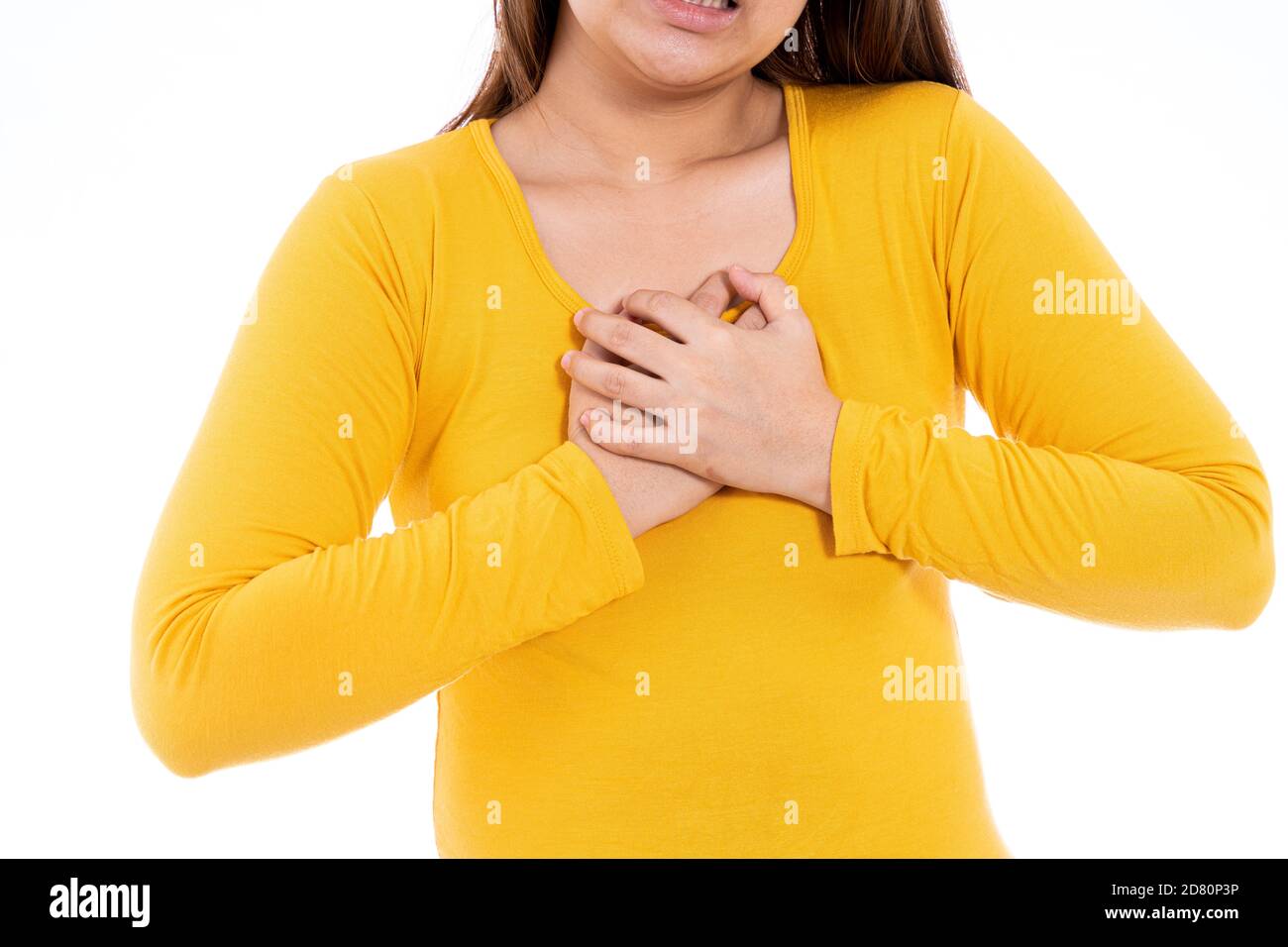 Woman touching her heart or chest isolated white background. Healthcare ...