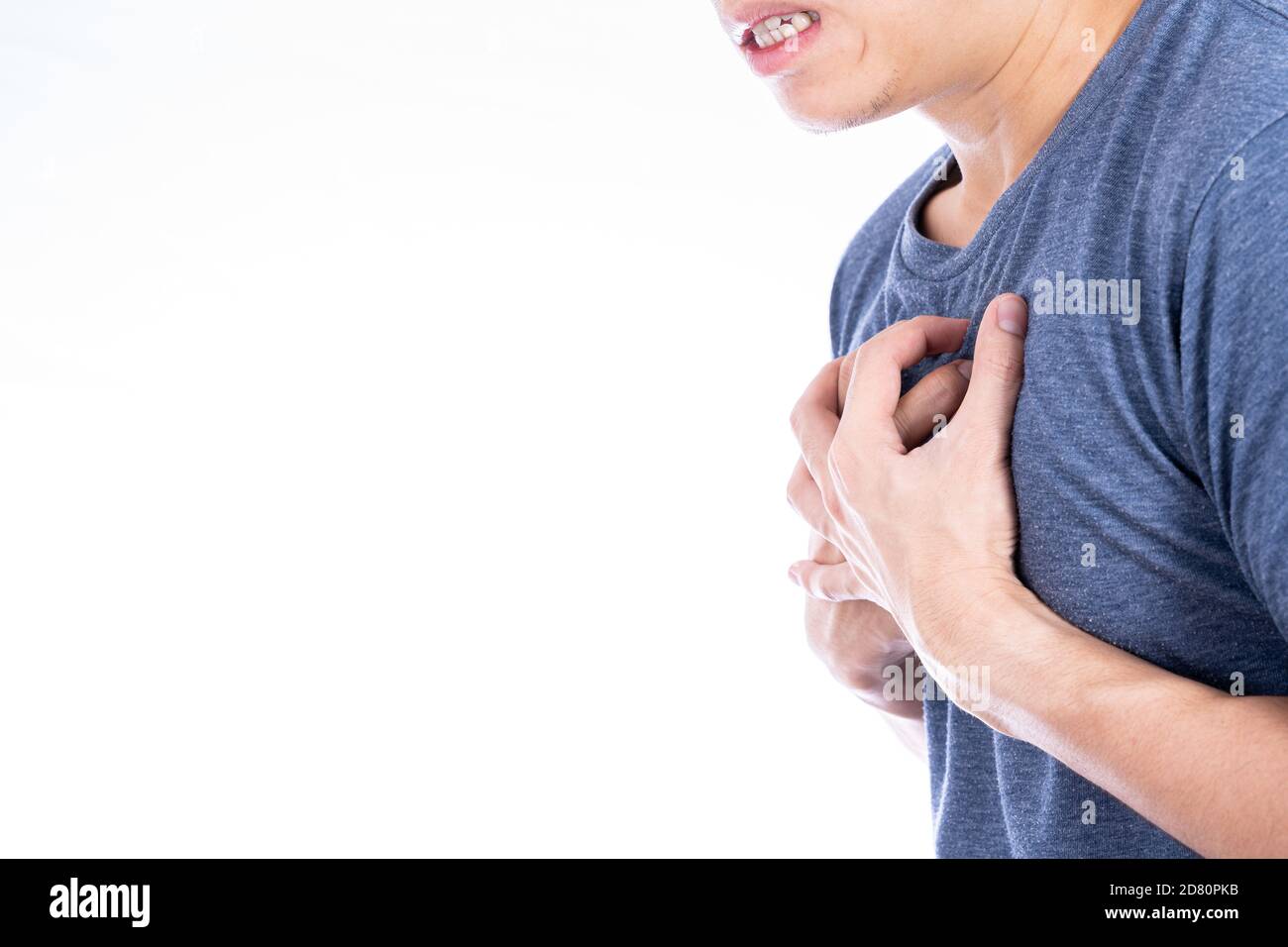 Man touching his heart or chest isolated white background. Healthcare ...