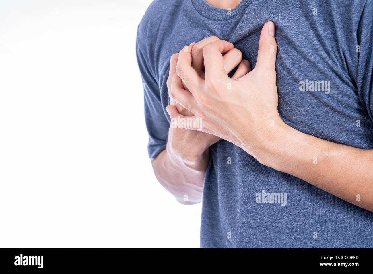 Man touching his heart or chest isolated white background. Healthcare ...