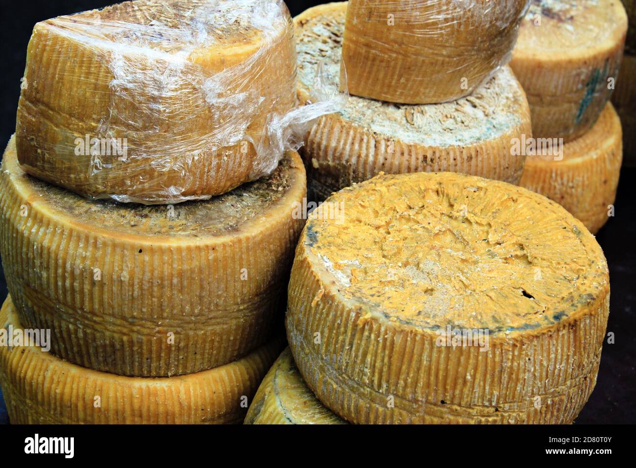 Big head cheese lying on stall at street market Stock Photo - Alamy