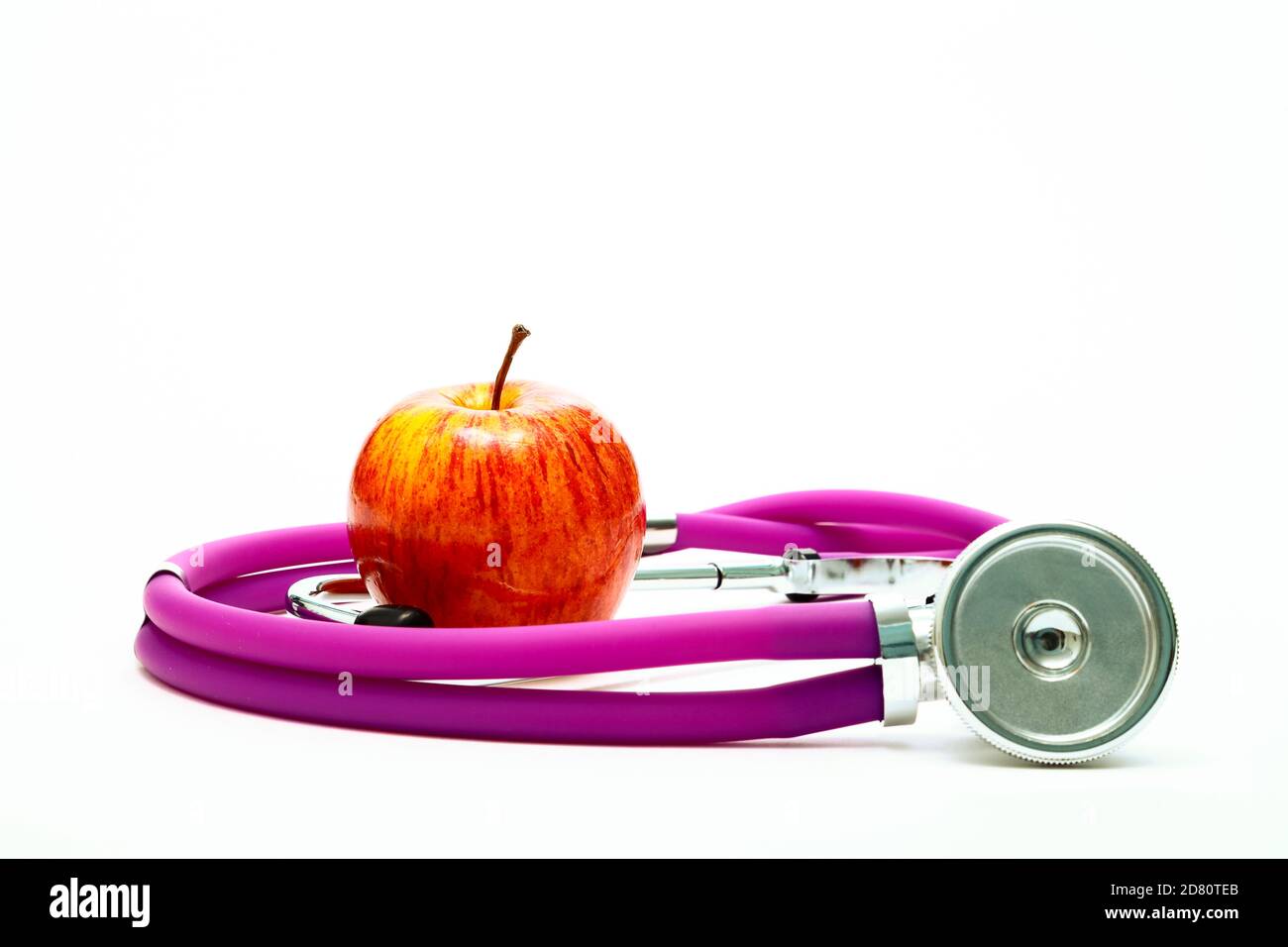 Conceptual healthy eating image of an eating apple and doctors ...