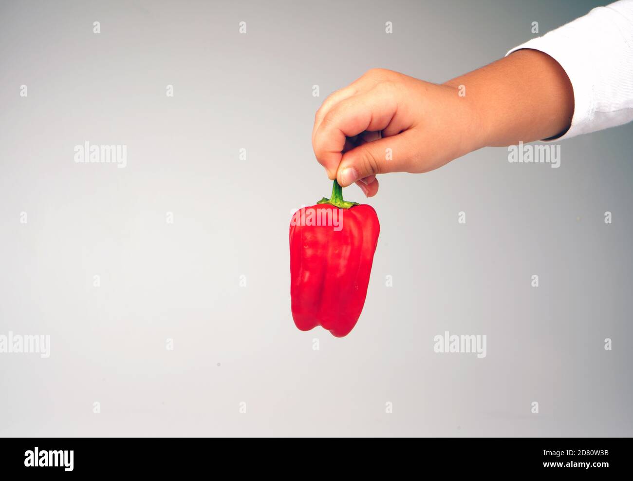 Bell pepper in hand hi-res stock photography and images - Alamy