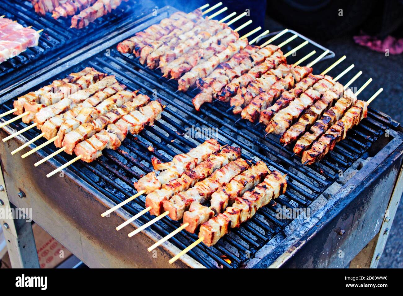 Outdoor barbecue, pork meat grilled Stock Photo - Alamy