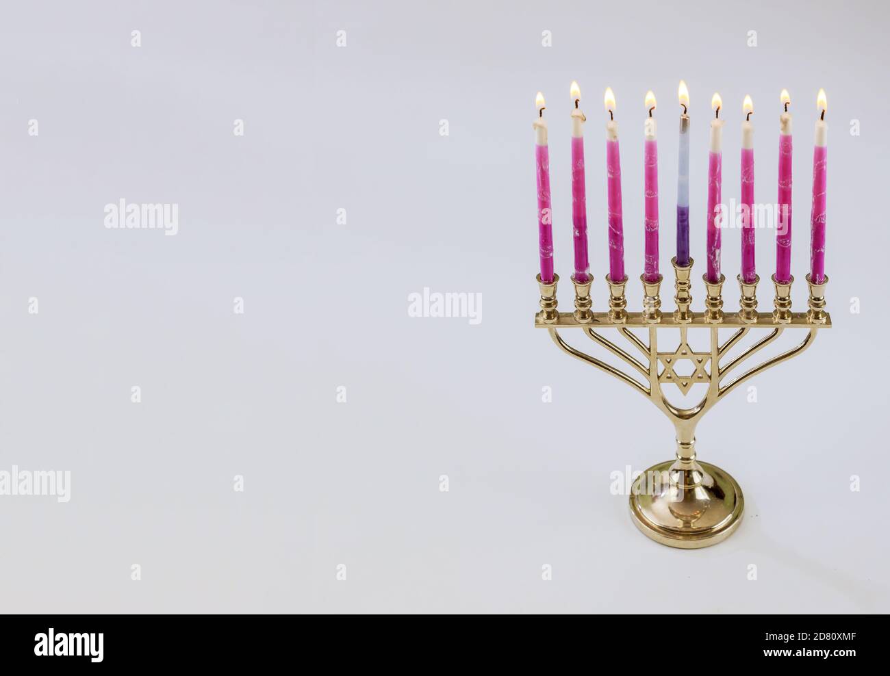 Traditional symbol hebrew Menorah of Hanukkah with burning candles is ...