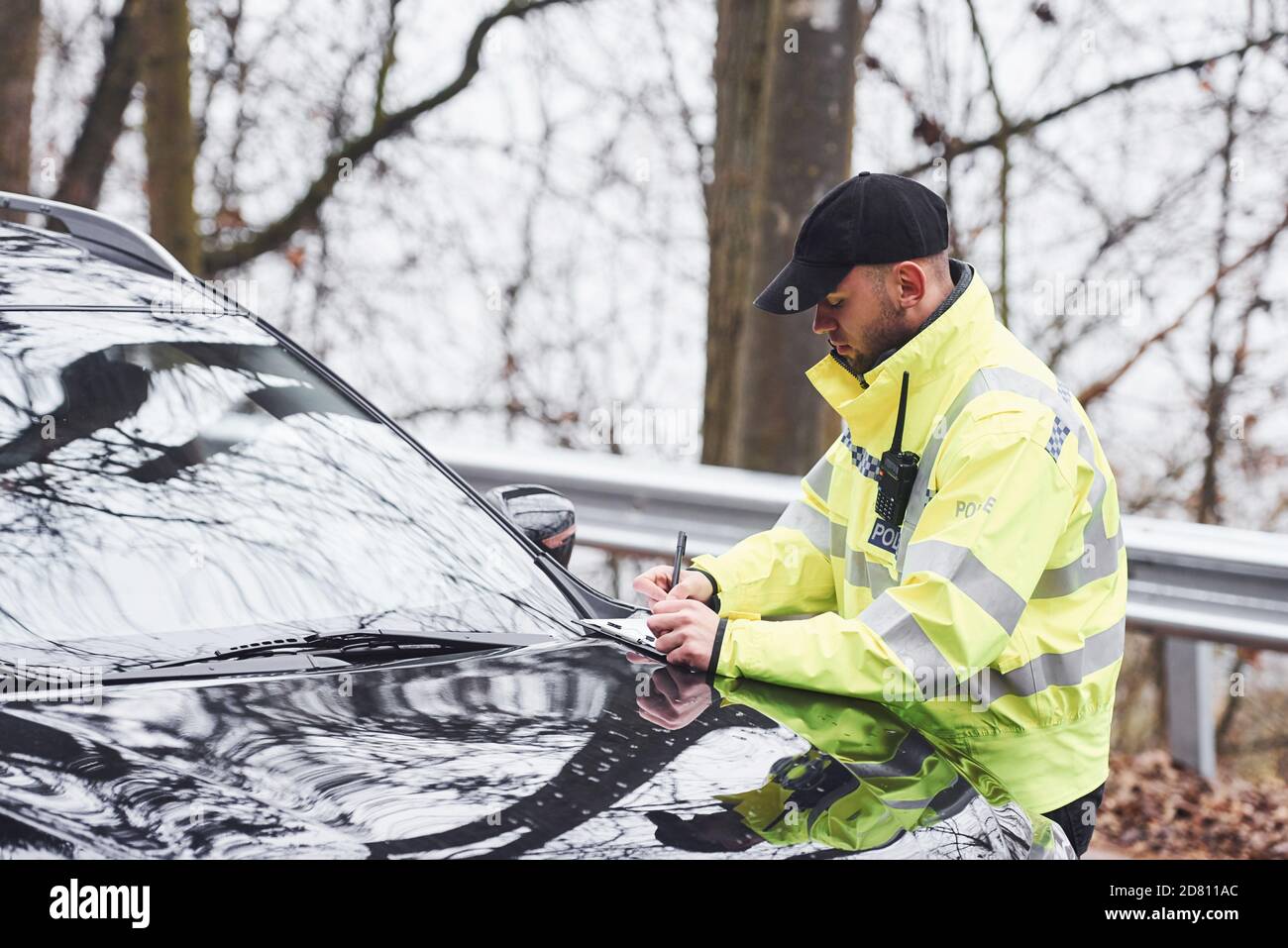 Police officer checking equipment hi-res stock photography and images ...
