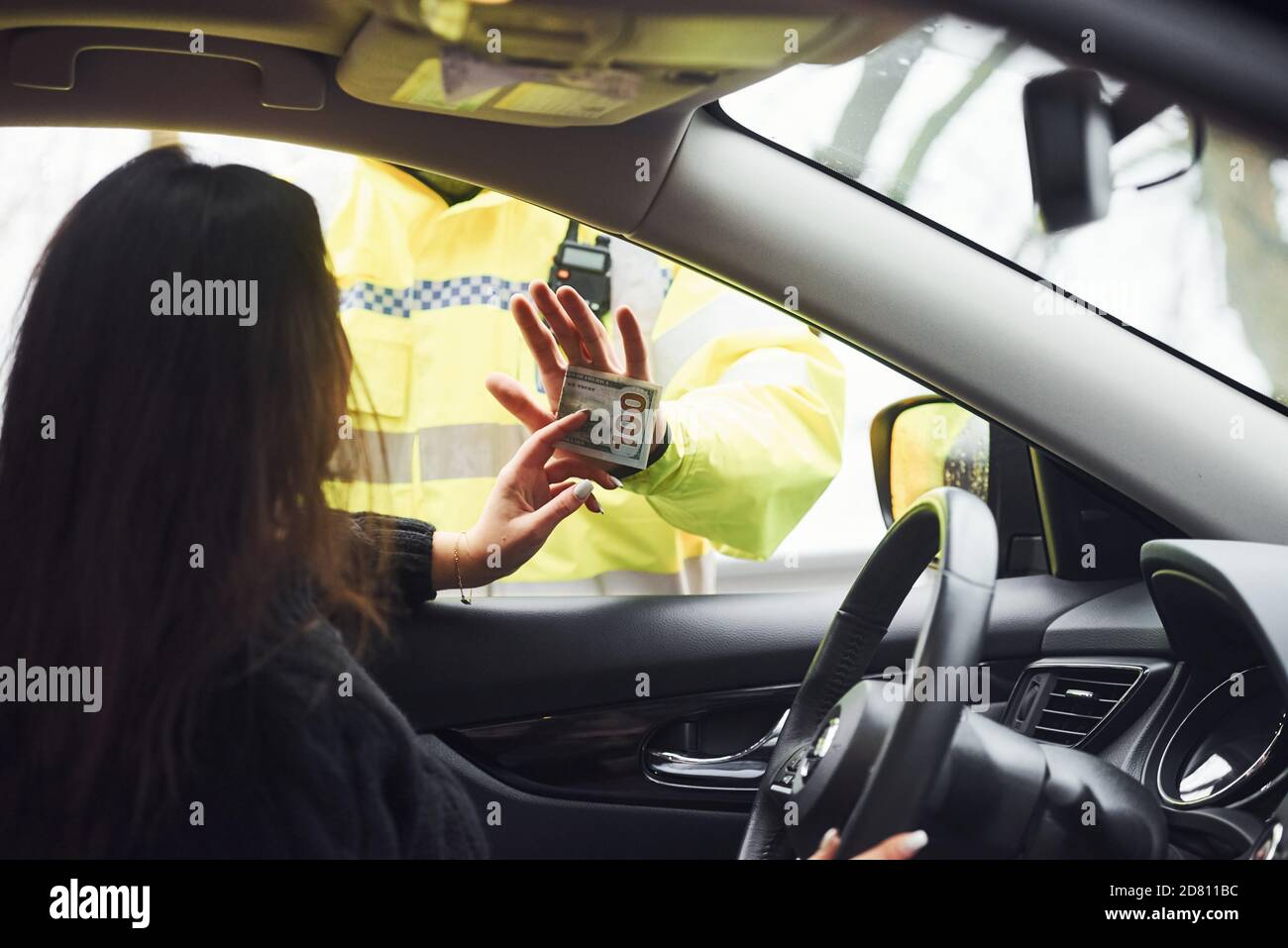 Male police officer in green uniform refuse to take bribe from woman in ...