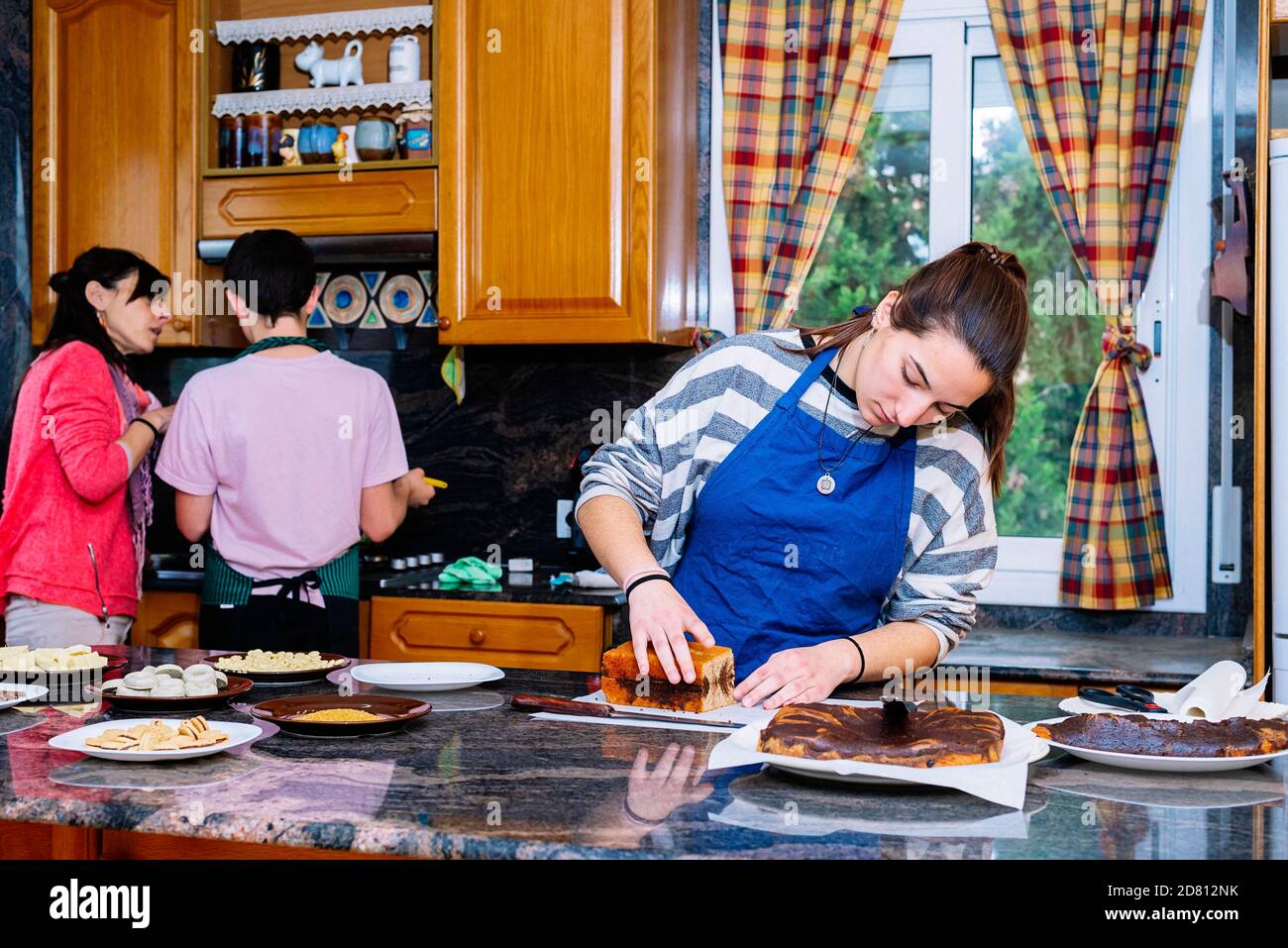 Family funny making chocolate cake at the kitchen Stock Photo - Alamy
