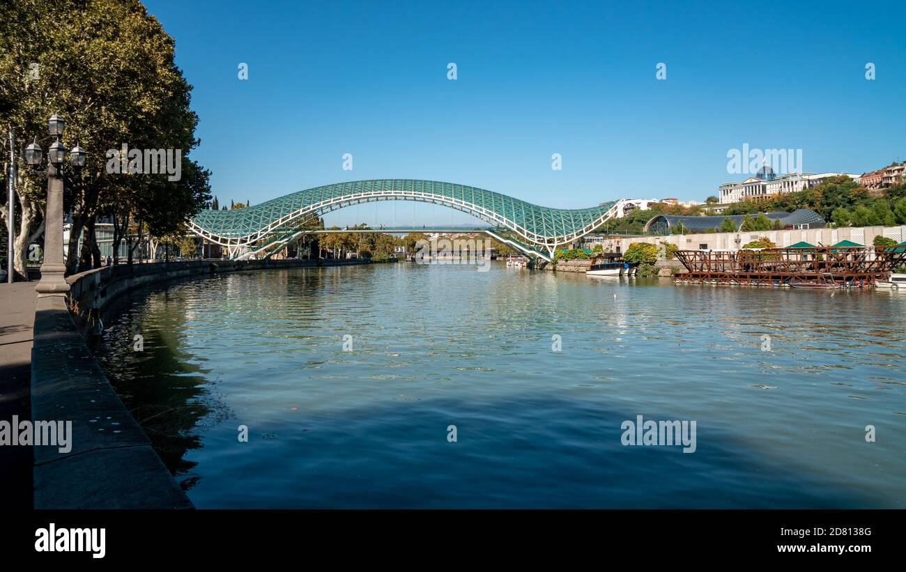 The Bridge of Peace in Tbilisi. View at the futuristic bridge made of ...