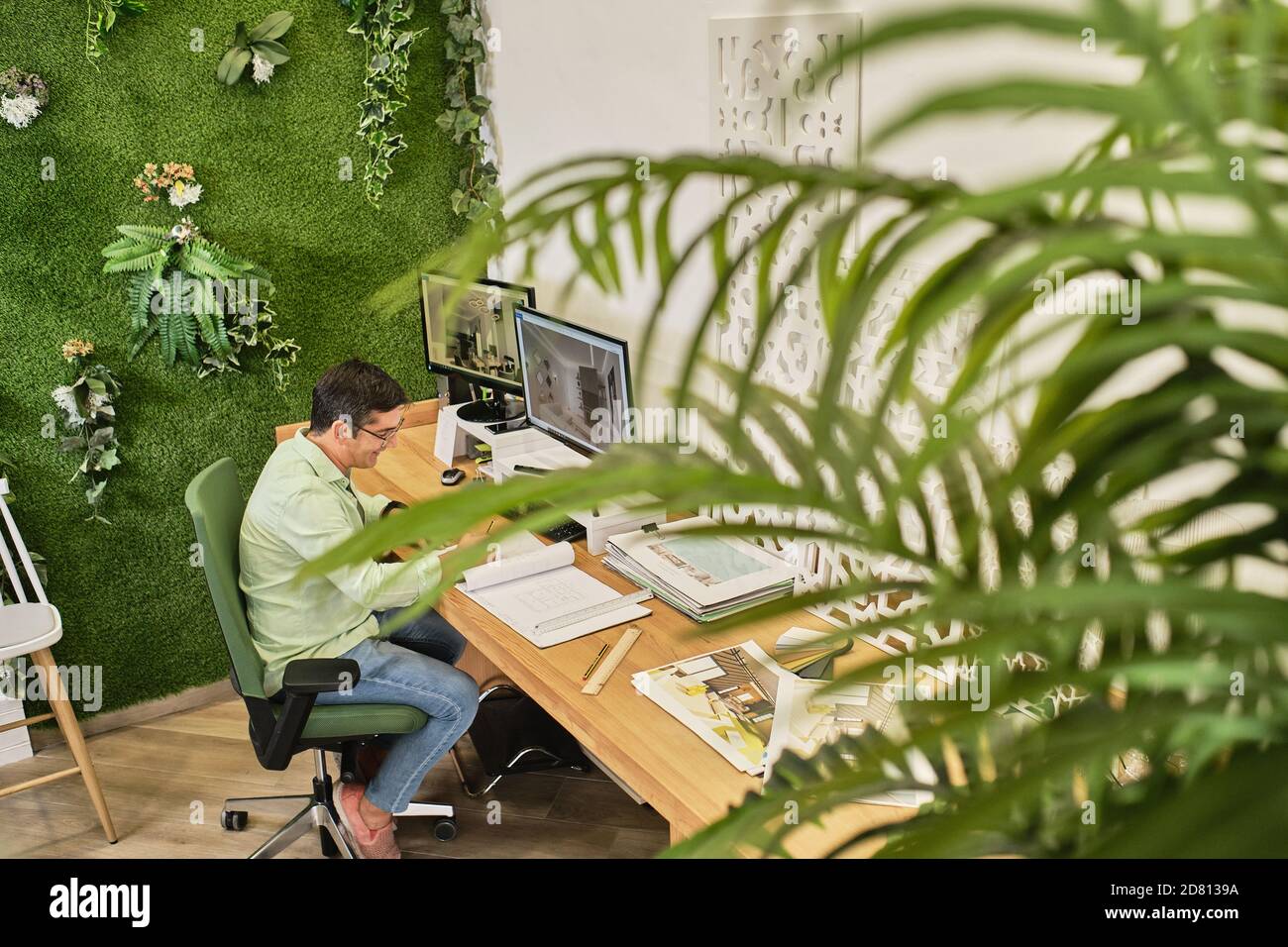 designer creates new designs sitting in his studio Stock Photo - Alamy