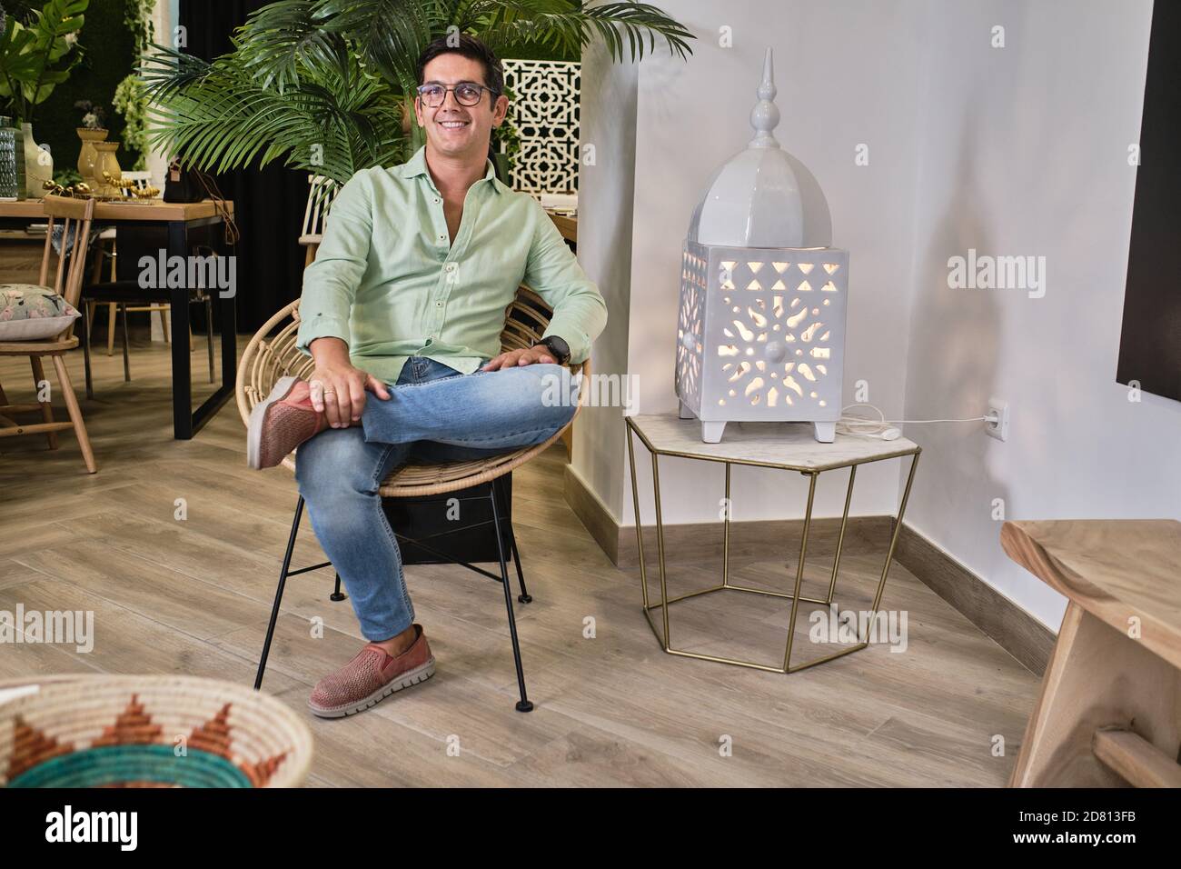 portrait of young boy sitting on a chair in his house Stock Photo - Alamy