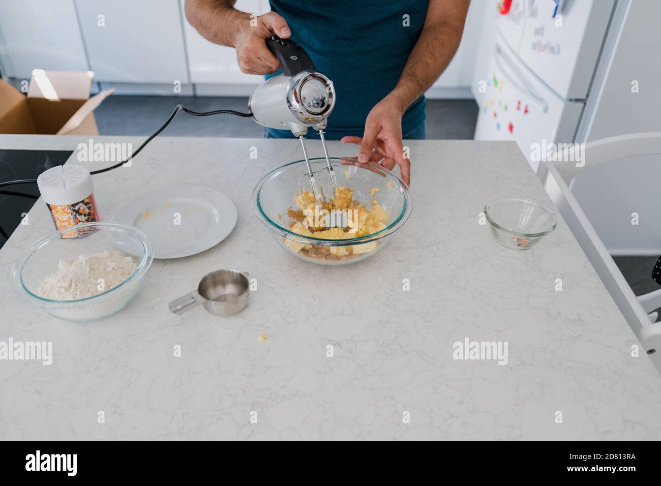 man mixing ingredients with electric mixer Stock Photo - Alamy