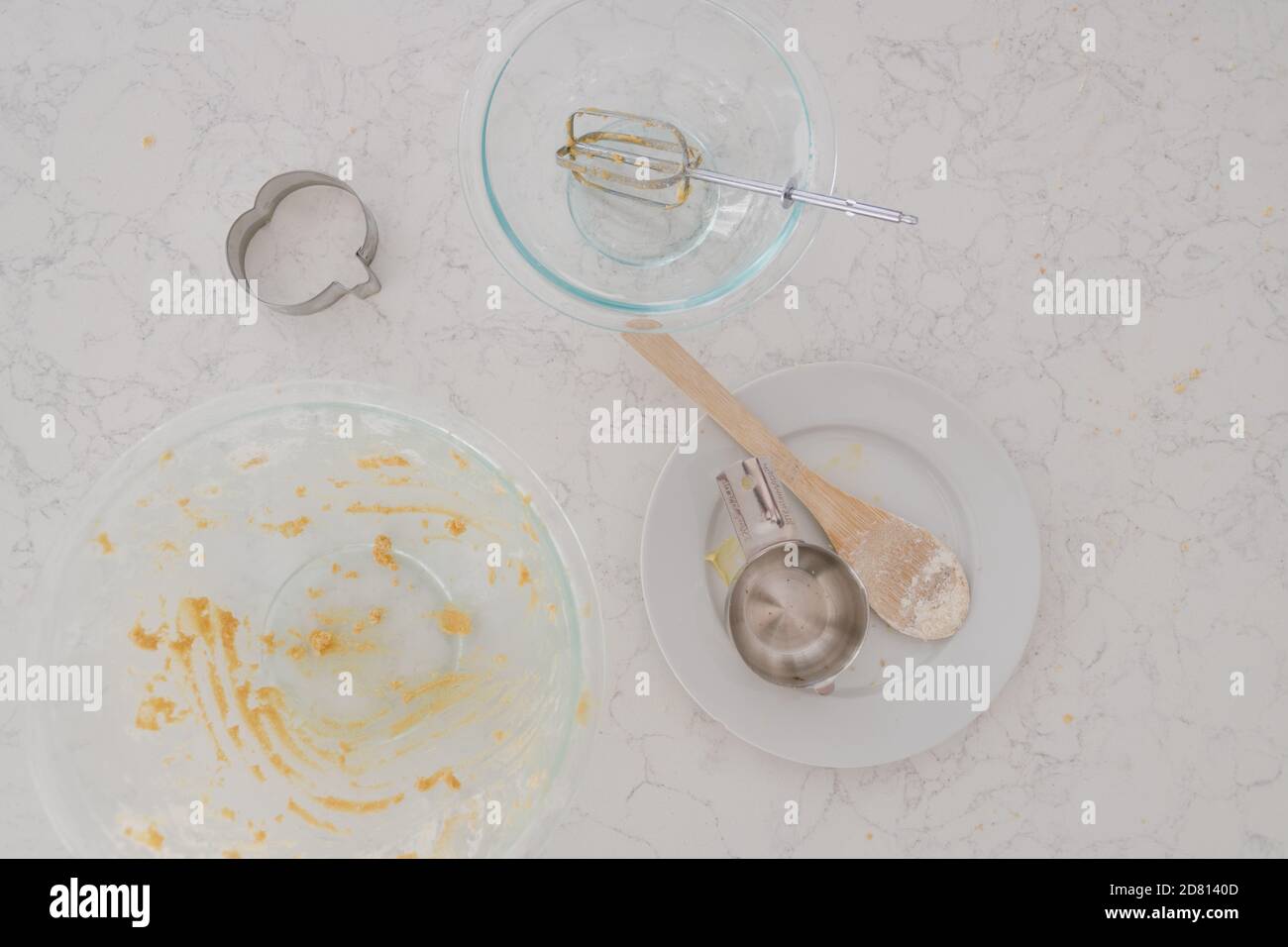 dirty dishes from baking cookies on white counter Stock Photo - Alamy