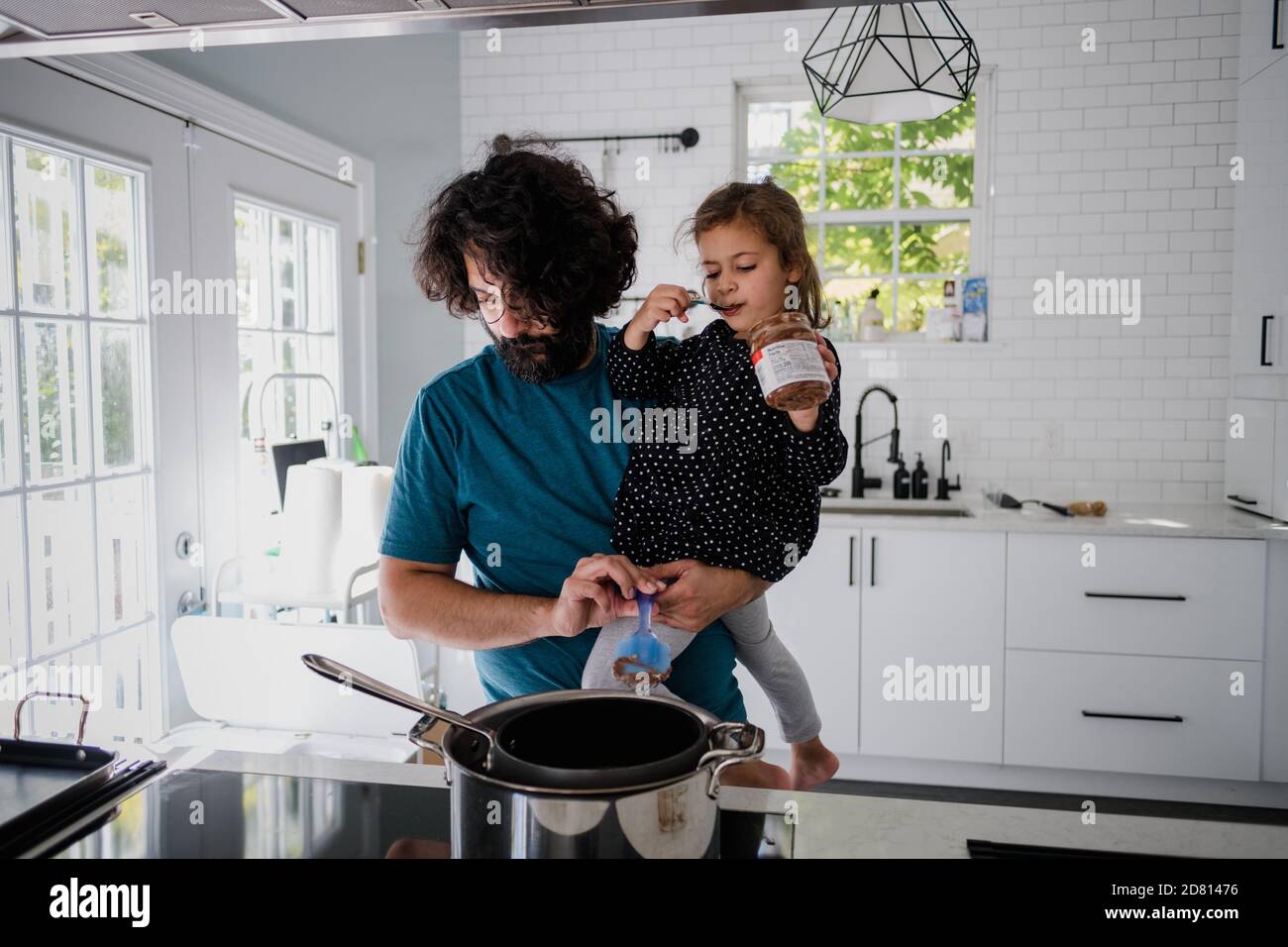 father and daughter cooking together in modern kitchen Stock Photo - Alamy