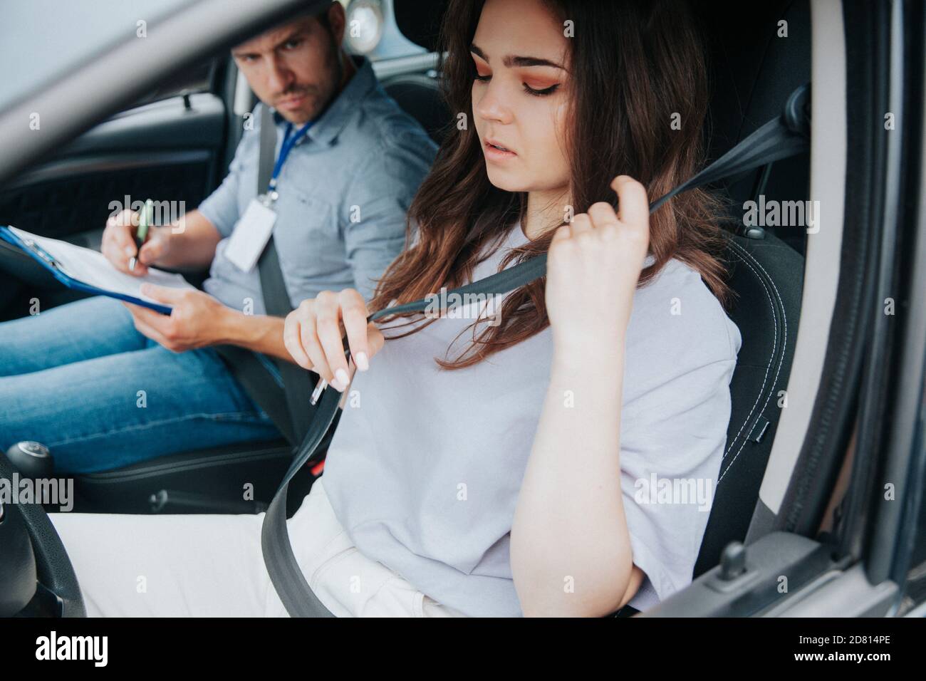 Driving instructor male student fastening hi-res stock photography and ...