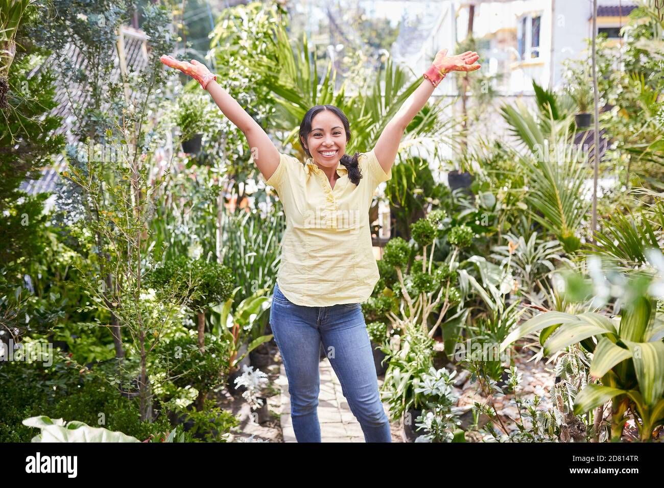 Young woman doing garden work Stock Photo - Alamy