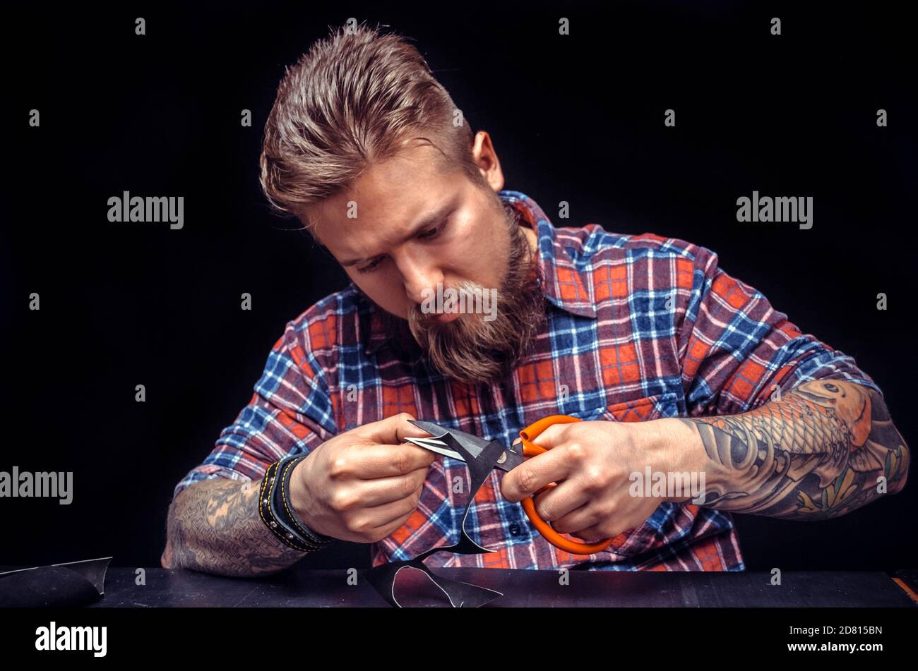 Currier creates a new leather product Stock Photo - Alamy