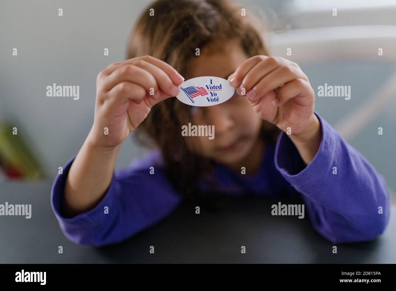 Little girl with an I voted Yo Vote sticker Stock Photo - Alamy