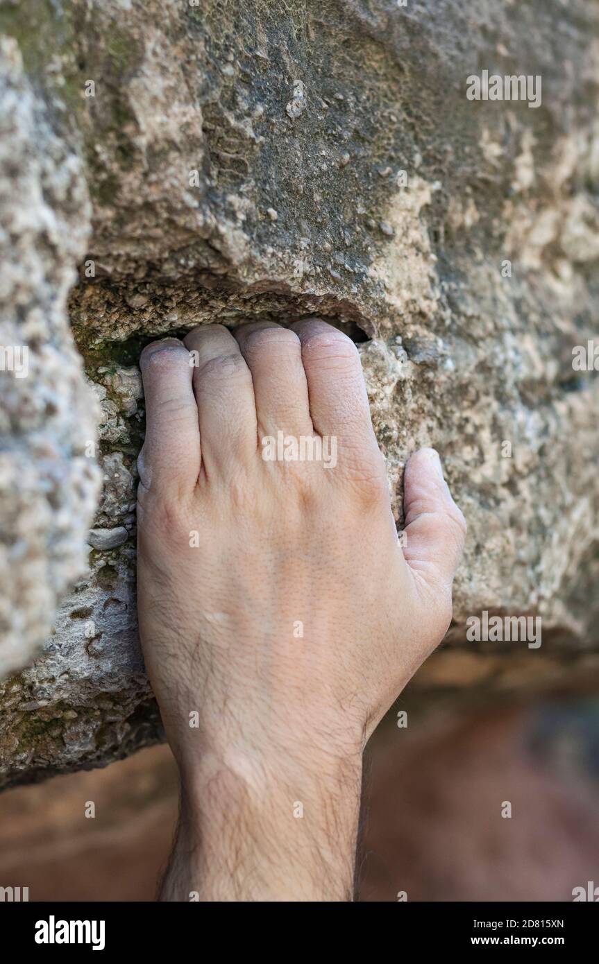 Climbing hand held to the stone, with strength Stock Photo - Alamy