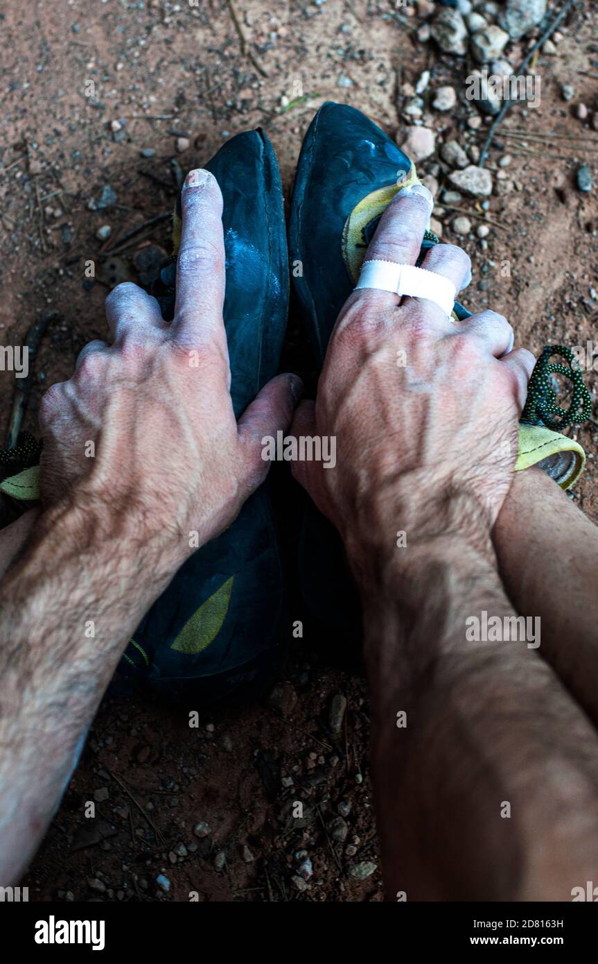 A climber's hands grabbing his feet, resting after the effort Stock ...