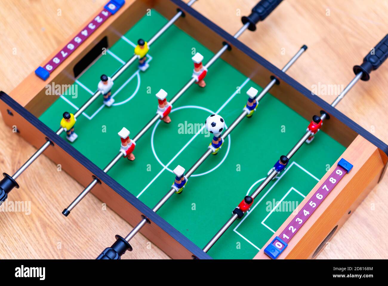 Close up table soccer with players and a ball Stock Photo - Alamy