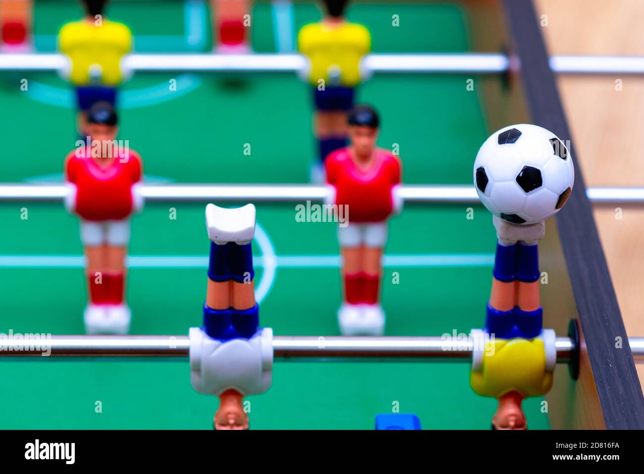 Close up table soccer with players and a ball Stock Photo - Alamy