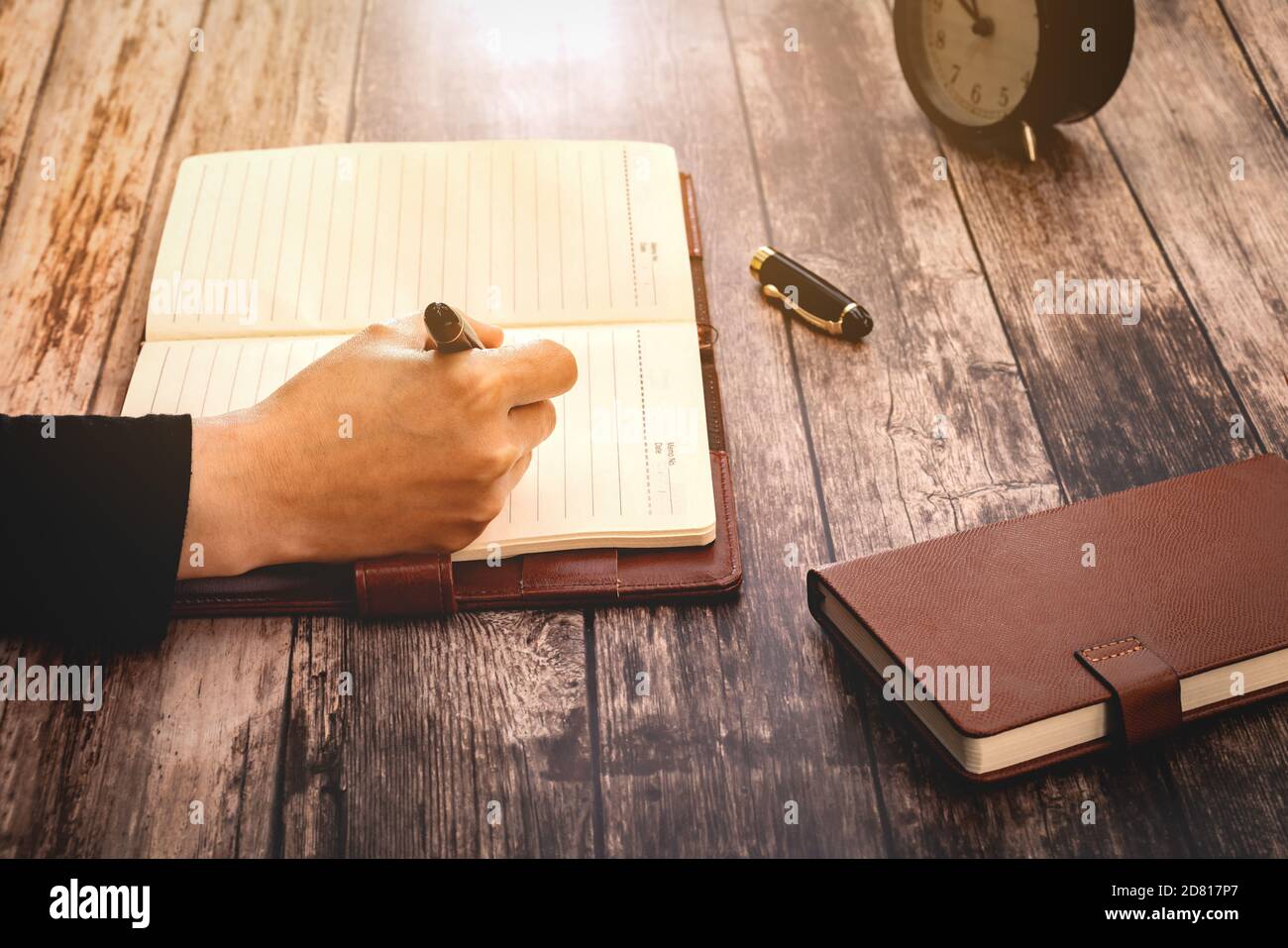 Woman hands drawing or writing, on wooden table. retro filter Stock ...