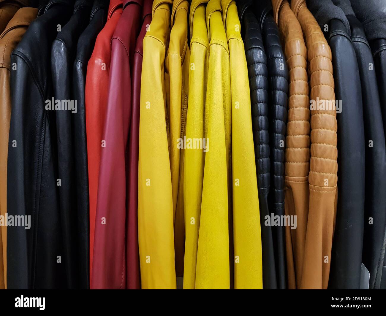 Collection of colorful leather jackets in a row Stock Photo - Alamy