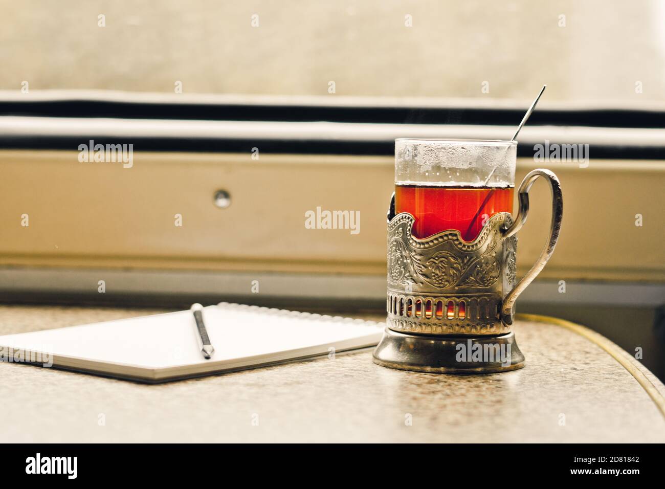 tea in a Cup holder on the train Stock Photo - Alamy