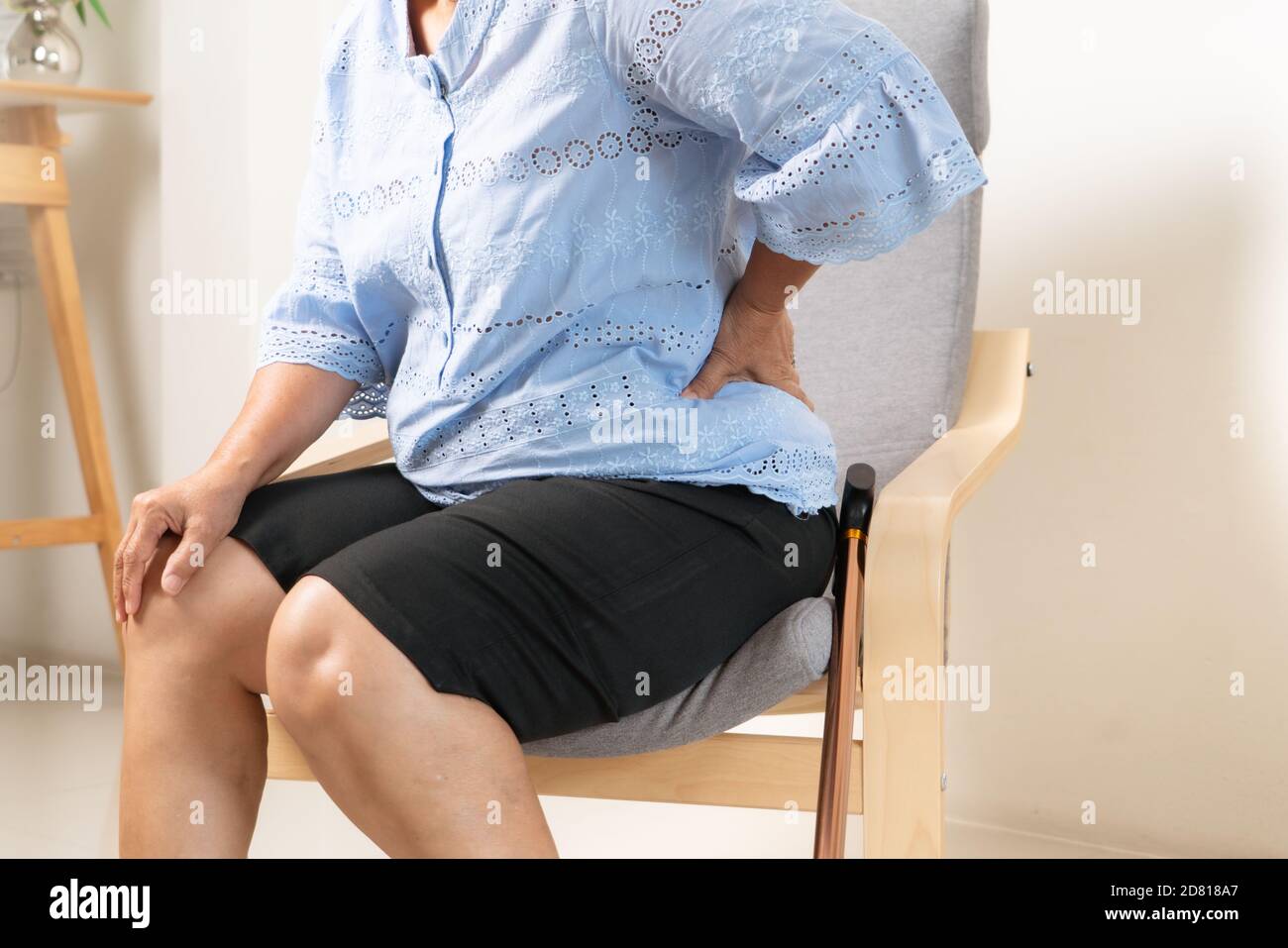 Old woman back pain at home, health problem concept Stock Photo - Alamy