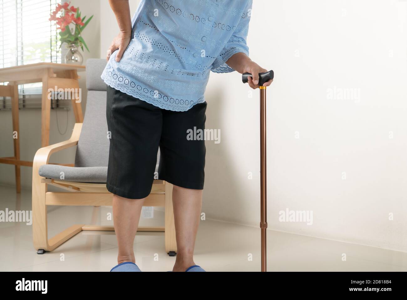 Old woman back pain at home, health problem concept Stock Photo - Alamy